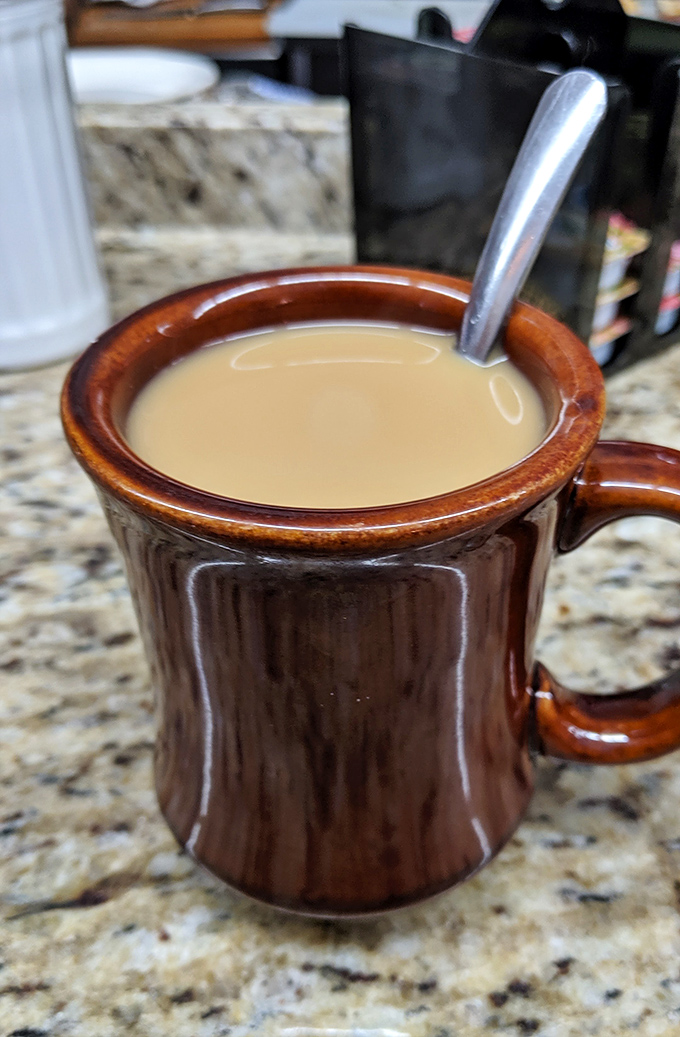 The coffee comes in mugs thick enough to withstand nuclear winter, containing a brew that's less about artisanal notes and more about jump-starting your day.