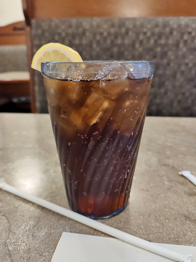 The classic American companion to Italian food&mdash;a tall, ice-cold cola with lemon that cuts through richness like a well-timed punchline.
