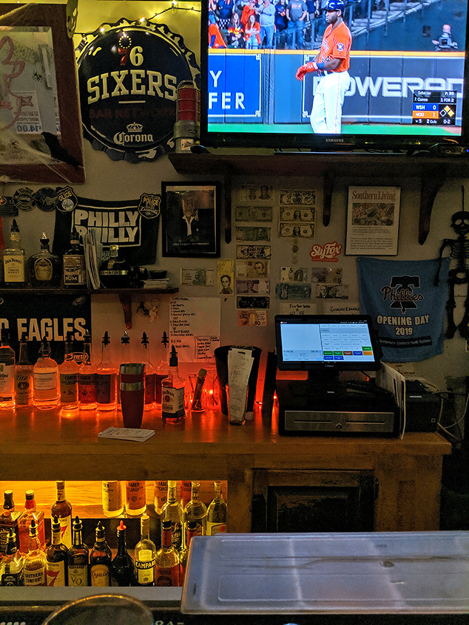 Behind the bar, Philadelphia sports memorabilia tells you everything you need to know about where you are and what matters here.
