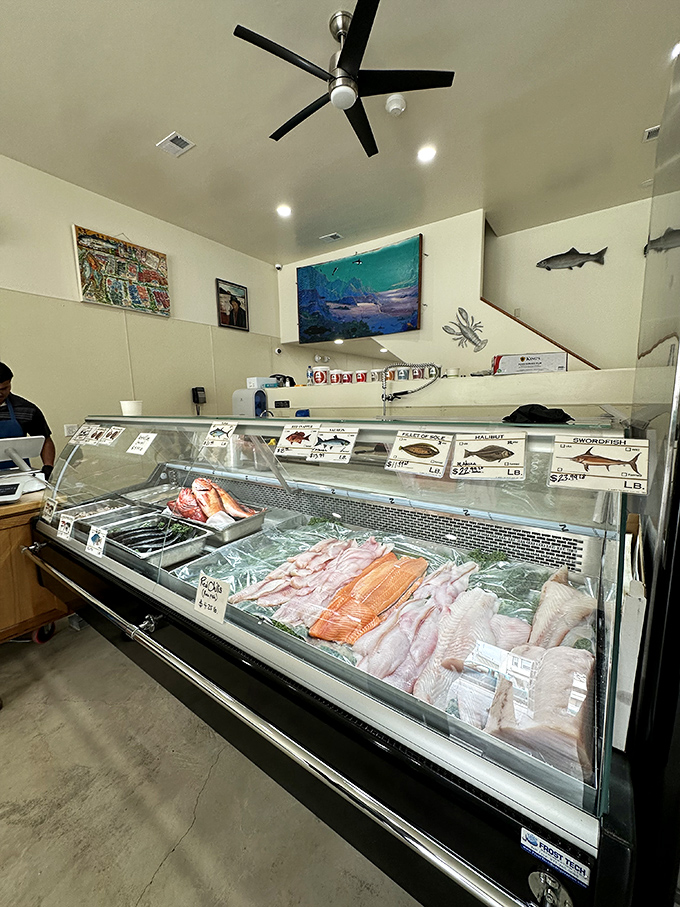 The fresh seafood counter showcases the day's catch with pride. Each fillet and whole fish is a promise of the meal that could be.