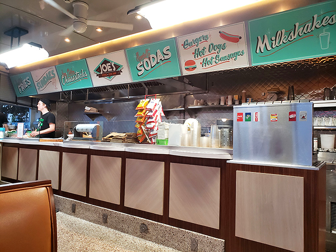 The counter beckons with its retro signage promising classic American delights &ndash; milkshakes, hot dogs, and sodas that taste like childhood memories.