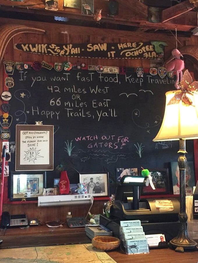 The chalkboard wisdom says it all: "If you want fast food, keep traveling." Some truths are universal, especially when gators are involved.