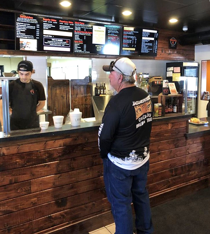 Where the magic happens &ndash; the ordering counter showcases the restaurant's rustic charm and no-nonsense approach to great food.
