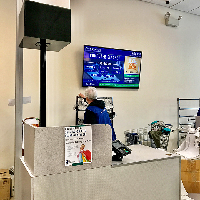 The checkout counter: final gateway between finding treasure and making it yours. That digital display likely announces the next bin rotation—prime intel for serious shoppers.