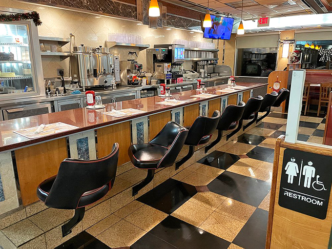 Counter seating &ndash; where solo diners become regulars, watching short-order ballet while morning news murmurs from the mounted TV.