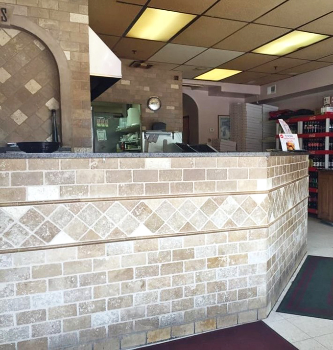 The counter where pizza dreams come true—a humble command center of deliciousness where orders are placed and anticipation begins.