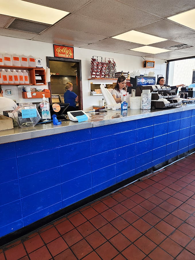 Behind this counter, magic happens without fanfare or pretension. Just honest food prepared by people who understand what comfort tastes like.