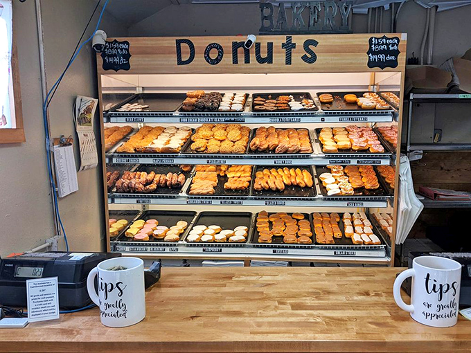 Behind this counter, magic happens daily as skilled hands transform simple ingredients into edible masterpieces that defy corporate competition.