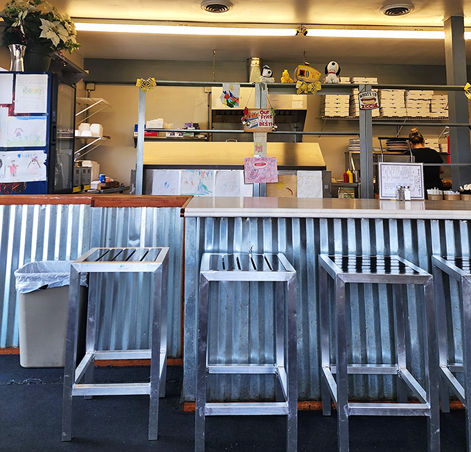 Counter seating that invites solo diners to perch and watch the choreography of short-order cooking while contemplating a second helping.