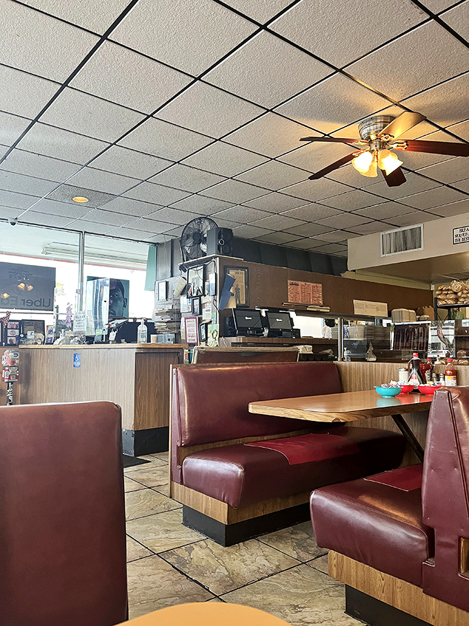 Classic diner counter seating&mdash;where solo diners become temporary neighbors and the coffee cup is never empty for more than thirty seconds.