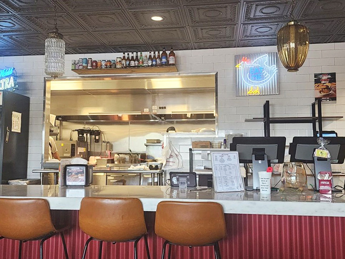The counter where magic happens – part kitchen command center, part gateway to happiness. Those bar stools offer front-row seats to the chicken show.