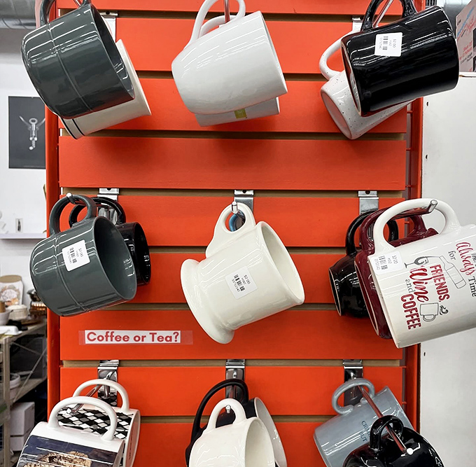 "Coffee or Tea?" asks the sign, but the real question is: which mug speaks to your morning personality? The sassy slogan or minimalist chic?