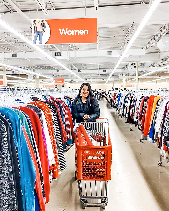 Happy hunters know the thrill of a well-stocked cart. That smile says "I just found cashmere for $6" better than words ever could.