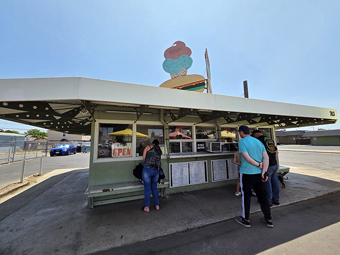 Happy customers proving that eating in your car never goes out of style.