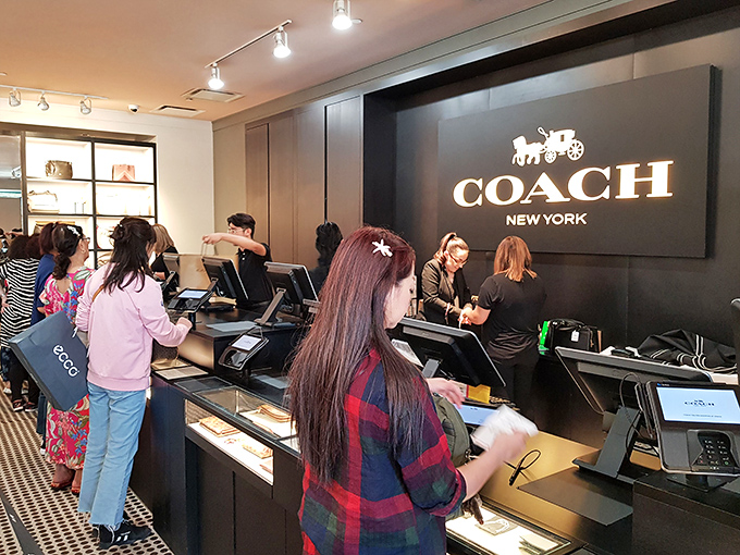 The Coach checkout counter&mdash;where credit cards come to sacrifice themselves on the altar of luxury goods at surprisingly reasonable prices.