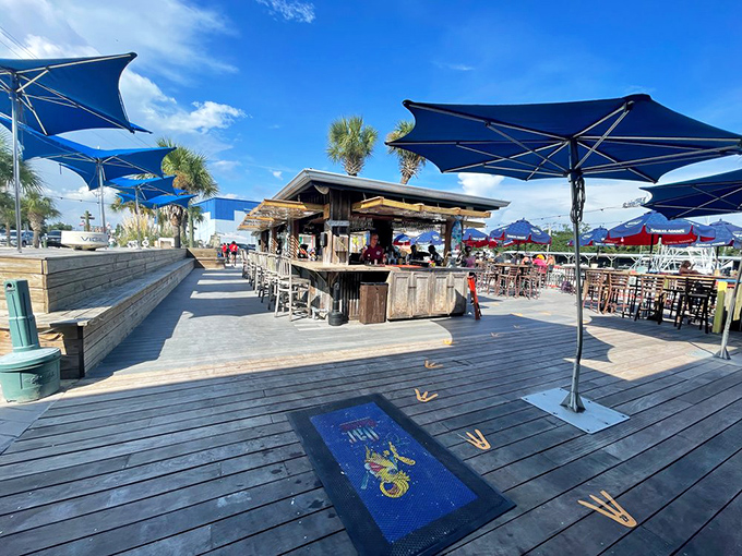 Outdoor bar perfection. This deck setup practically whispers "order something frozen and fruity" as boats drift by in the background.