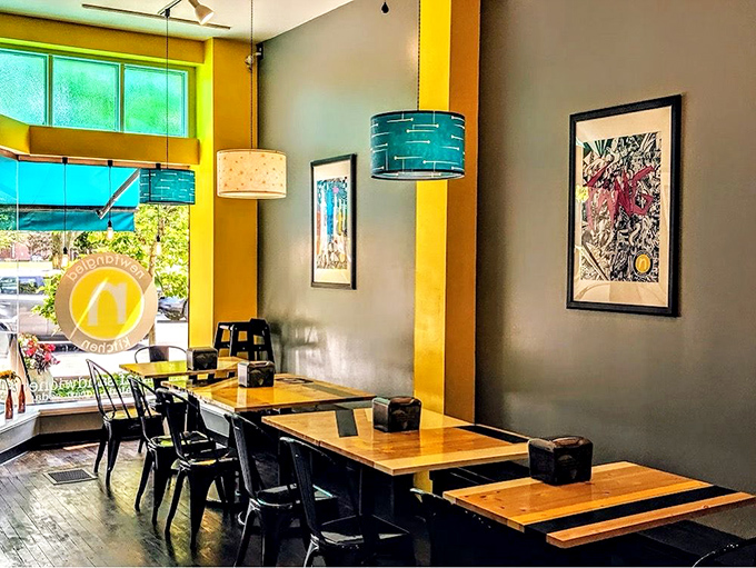 Splashes of yellow brighten gray walls while turquoise pendant lights cast a cool glow. This isn't just décor—it's a mood you want to savor.