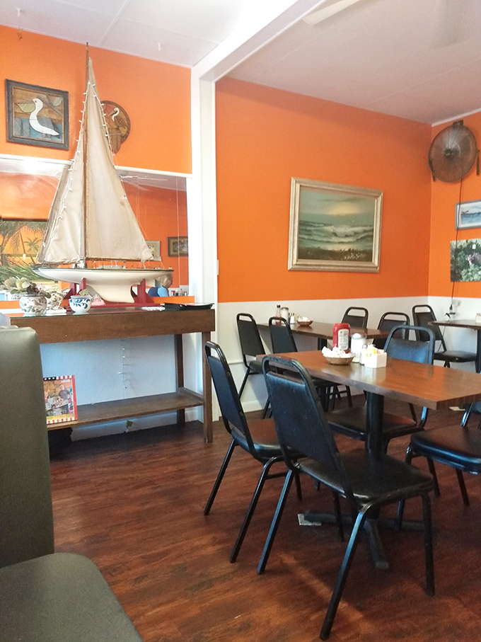 Nautical touches and bright walls create a dining room that feels like Florida without shouting "tourist trap" at every turn.