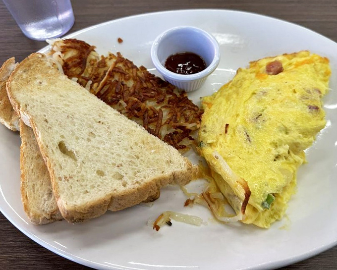 This isn't just an omelet&mdash;it's a perfectly executed morning masterpiece with toast standing by for essential yolk-sopping duties.