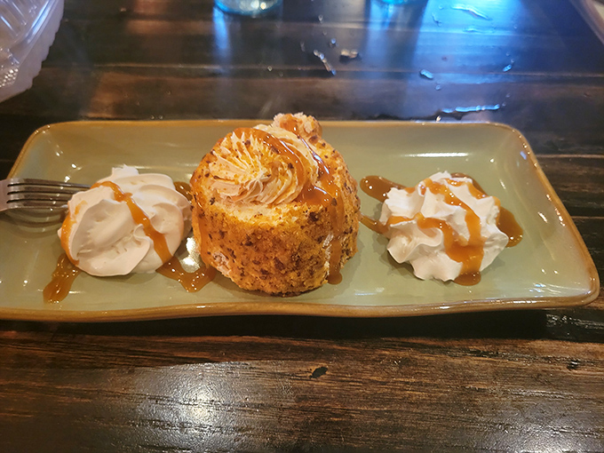 This dessert arrives like the grand finale of a fireworks show, complete with caramel drizzle applause.