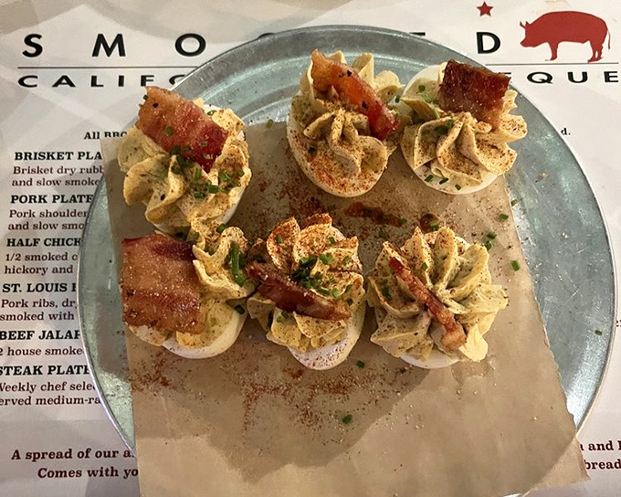 Deviled eggs elevated beyond picnic status, each bite delivering creamy perfection with smoky barbecue flair.