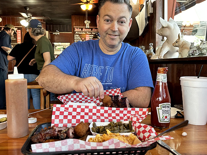 In the image, a diner prepares to tackle a barbecue feast spread before him&mdash;the red-checkered paper suggests this isn't his first rodeo.