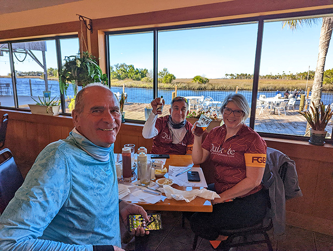Happy diners with waterfront views&mdash;the universal expression of people who've just discovered their new favorite restaurant.