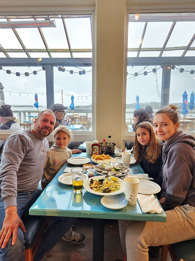 Nothing says "California coastal dining" like families making memories over plates of fresh-caught treasures by the water.