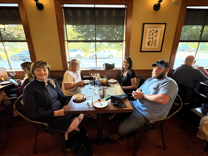 Happy diners caught in their natural habitat&mdash;the moment right before the "should we get dessert?" conversation that always ends with "absolutely we should." 