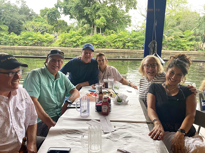 Waterfront dining with good company&mdash;the true Florida trifecta. Those smiles say everything about the Rustic Inn experience.