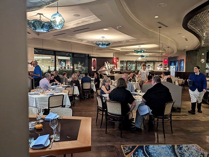 The dining room hums with the universal language of "mmm" as servers glide between tables like dancers in a delicious ballet.