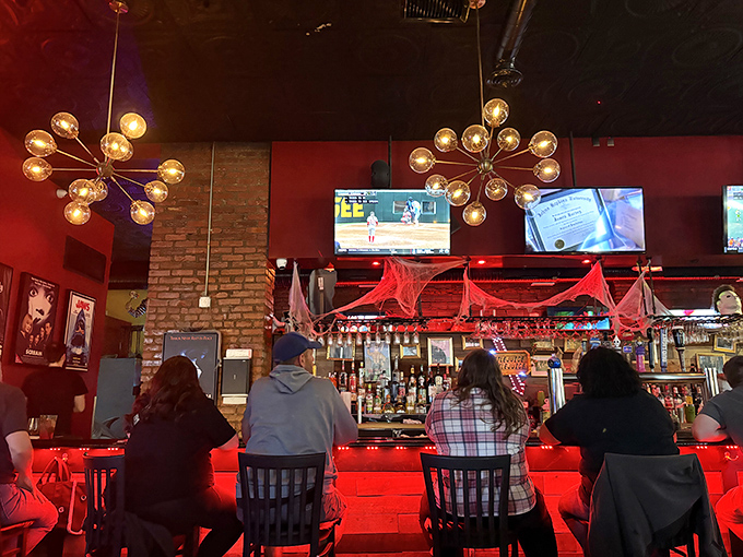 Locals casually dining beneath monster portraits, because in Cleveland Heights, this is perfectly normal Tuesday behavior.