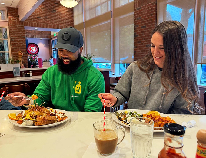 Happy diners sharing a moment of breakfast bliss &ndash; the universal language of "this was definitely worth getting out of bed for."