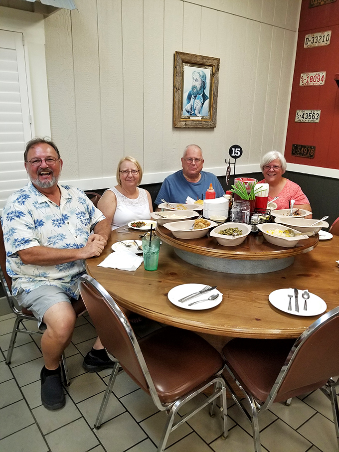 Happy diners gathered around a lazy Susan loaded with Southern delights&mdash;this is what Sunday dinner is supposed to look like.