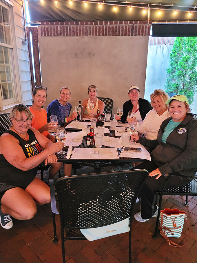 Friends gathering on the patio, raising glasses to good times &ndash; the true essence of what makes Buckley's special.