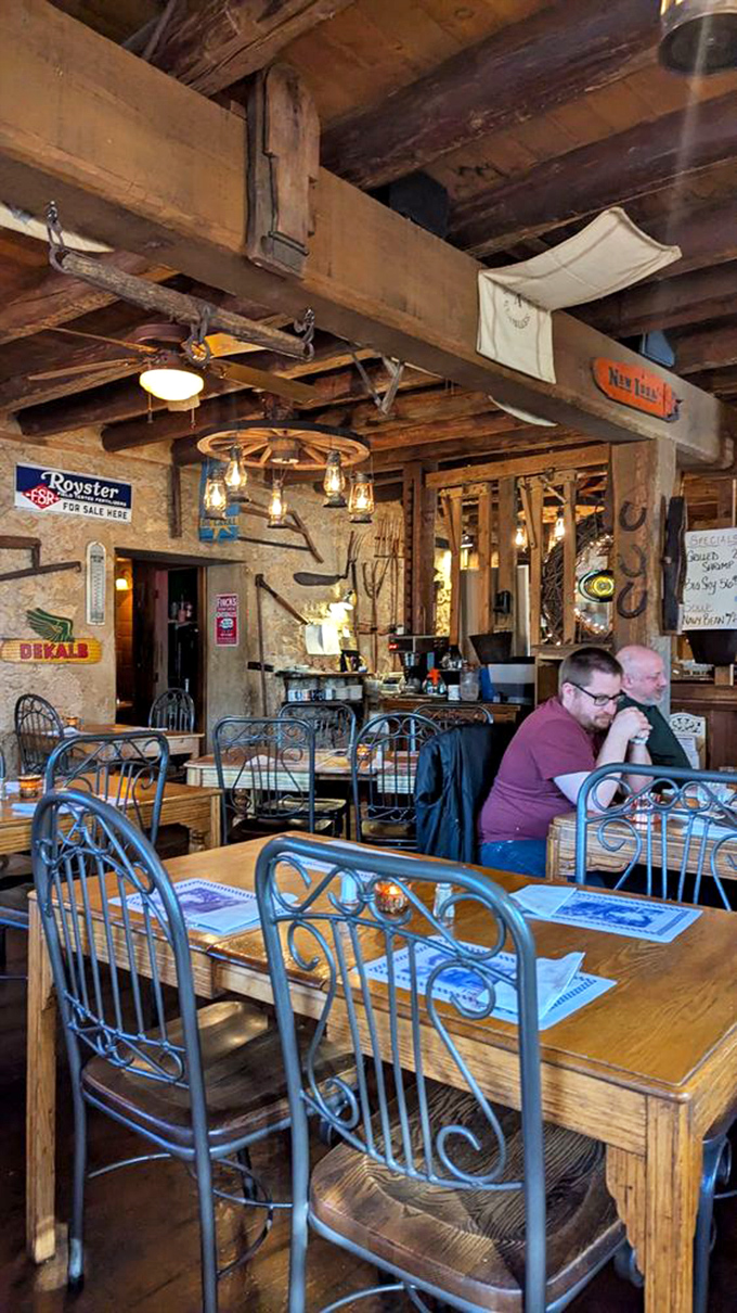 Wooden beams, farm implements, and vintage signs create dining spaces where conversations flow as easily as the Wisconsin craft beers.