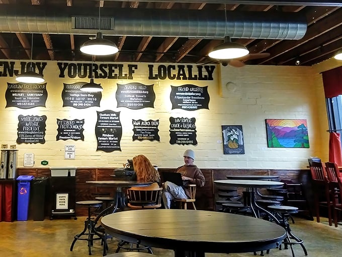 "Enjoy Yourself Locally" isn't just wall art&mdash;it's the Phoenix philosophy, creating a space where coffee, conversation, and community naturally blend.
