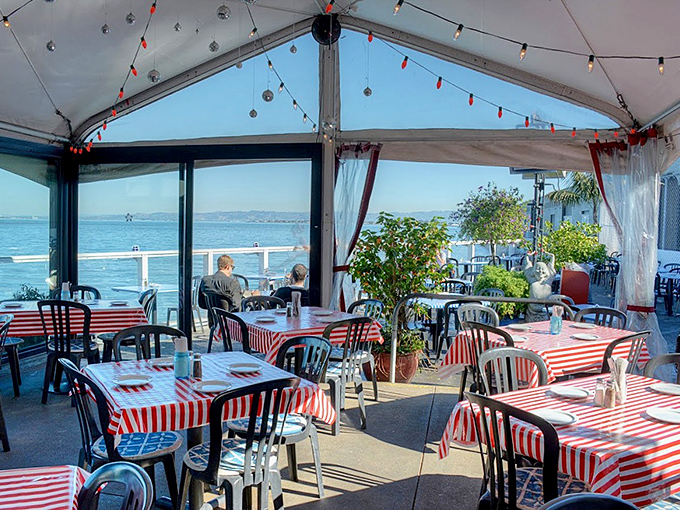 Waterfront dining with red and white stripes - like having a picnic where someone else does the cooking.