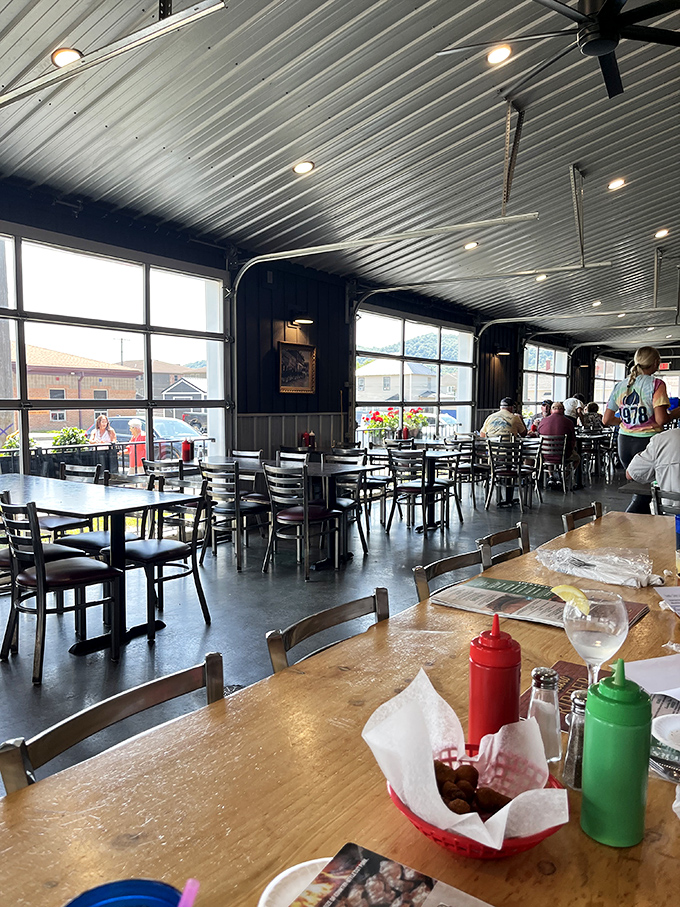 Sunlight streams through garage-style windows, illuminating a dining room where meat dreams come true and diet plans go to die.