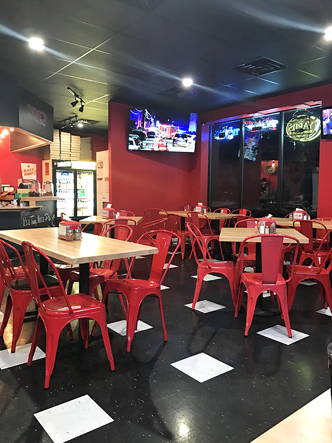 Modern meets tradition with these vibrant red chairs and checkerboard floor. The space invites you to settle in and stay awhile.