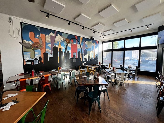 The dining room balances modern style with comfort, where every table offers a view of that magnificent burger-themed mural.