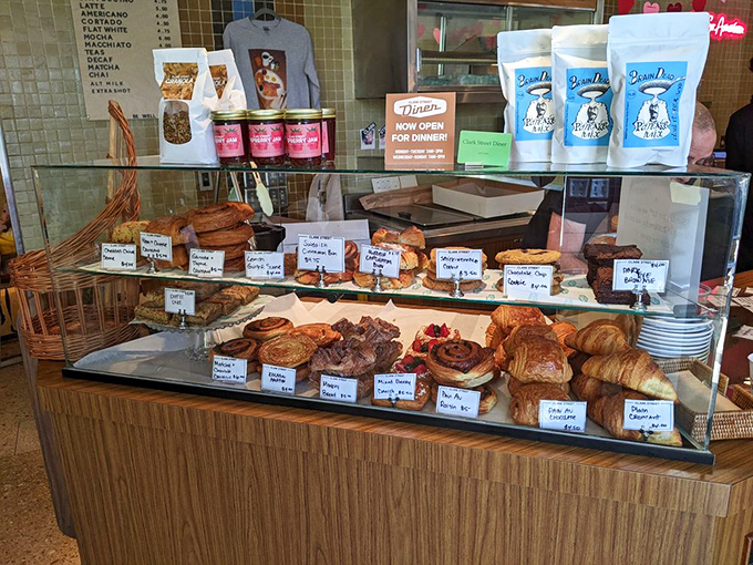The pastry case&mdash;a glass-enclosed museum of carbohydrate artistry where willpower goes to die a delicious death.