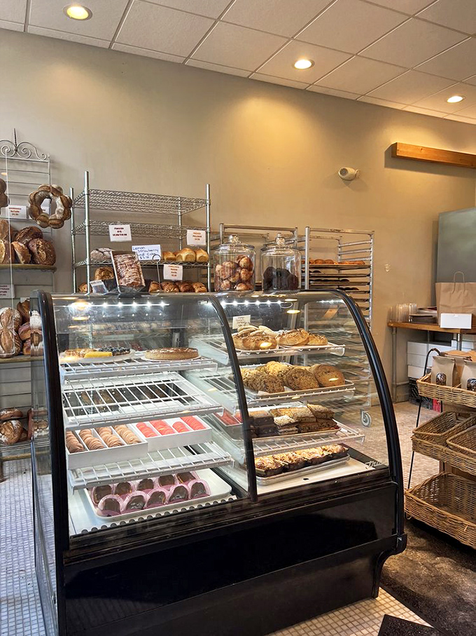 The curved glass case &ndash; a museum of carbohydrate masterpieces where willpower goes to surrender gracefully.