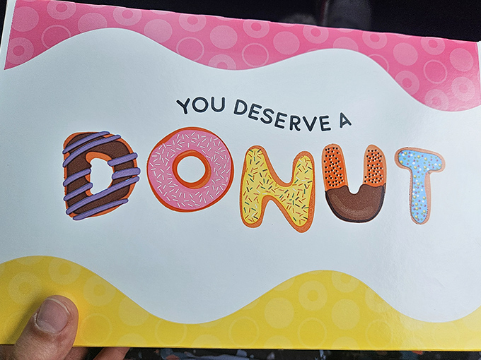 "You Deserve A Donut" might be the most honest marketing slogan ever created. A pink permission slip for indulgence we should all carry.