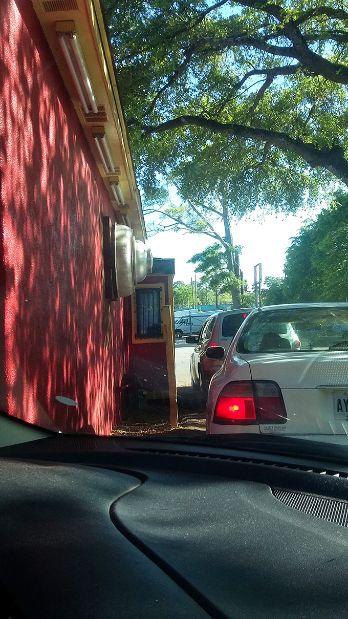 The drive-thru experience: where the dappled sunlight through Georgia trees makes waiting for your hot dog feel almost poetic.