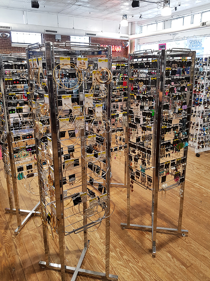 Golden earrings dangle like tiny chandeliers, promising to add glamour to grocery runs and dinner dates alike.