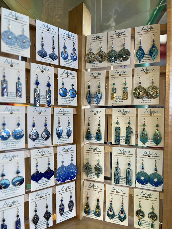 A kaleidoscope of handcrafted earrings in ocean blues and greens&mdash;wearable art that connects you to both past and present.