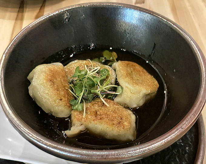 These dumplings aren't merely sitting in sauce&mdash;they're luxuriating in it, like tiny edible spa-goers enjoying their hot tub moment.