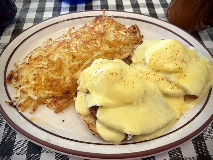 Eggs Benedict getting the royal treatment atop hash browns that could convert even the staunchest health food advocate.
