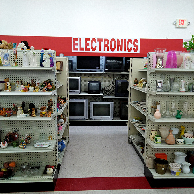 The electronics section, where vintage TVs meet quirky collectibles in a nostalgic corner that's part museum, part tech graveyard.